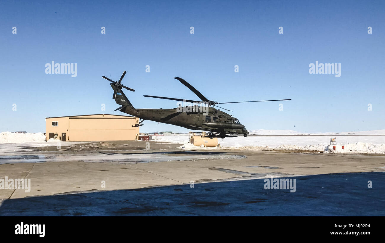 An Alaska Army National Guard UH-60 Blackhawk lifts off from its ...