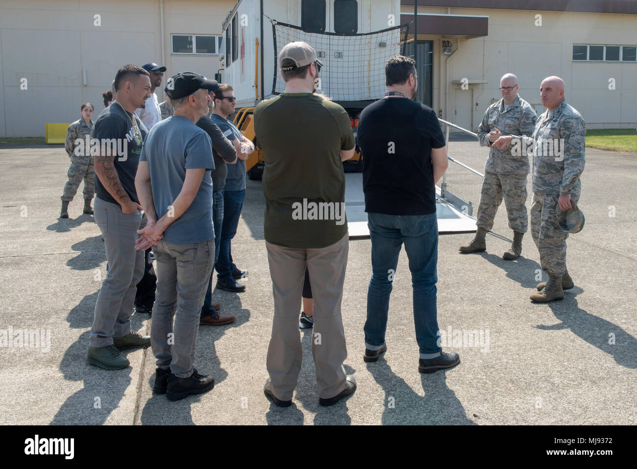 Col. Kenneth E. Moss, 374th Airlift Wing commander, takes a moment to ...