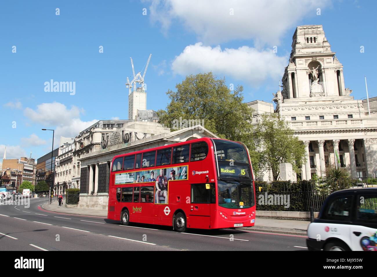 LONDON - MAY 16: People ride hybrid London Buses on May 16, 2012 in ...