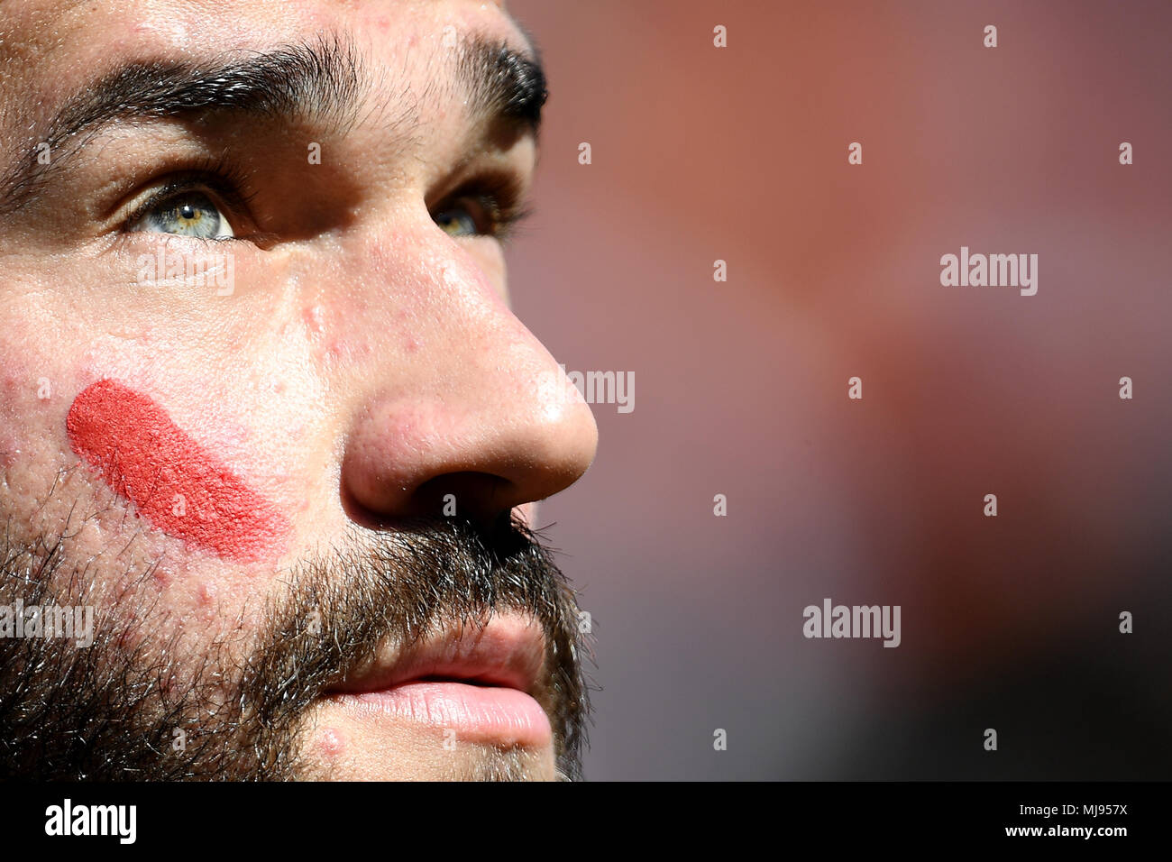 Alisson Becker with red mark on the face for the campaign against ...