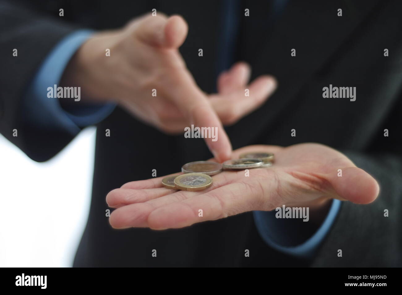 Hand businessman holding change hi-res stock photography and images - Alamy