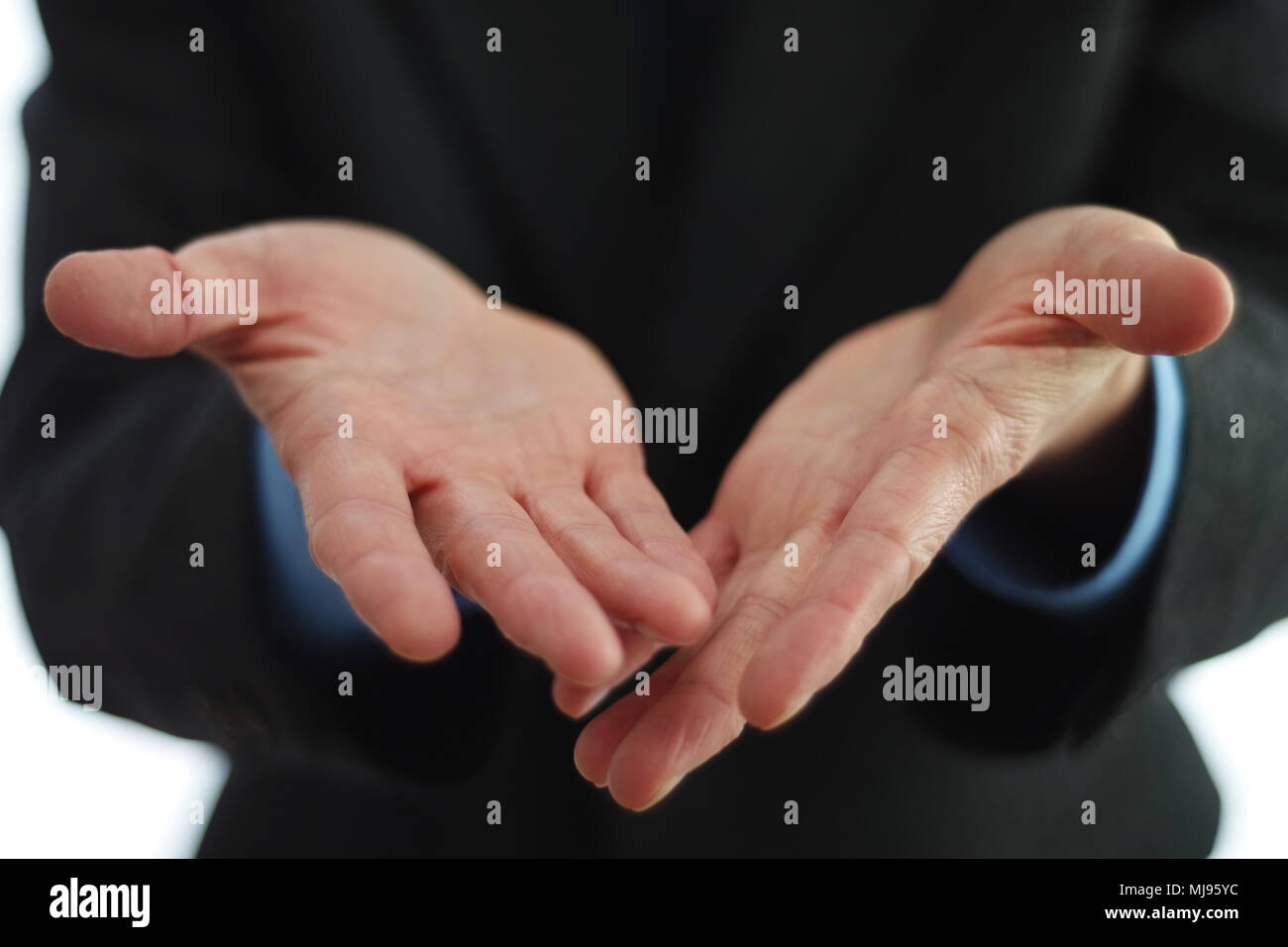 Offering something with hands Stock Photo - Alamy