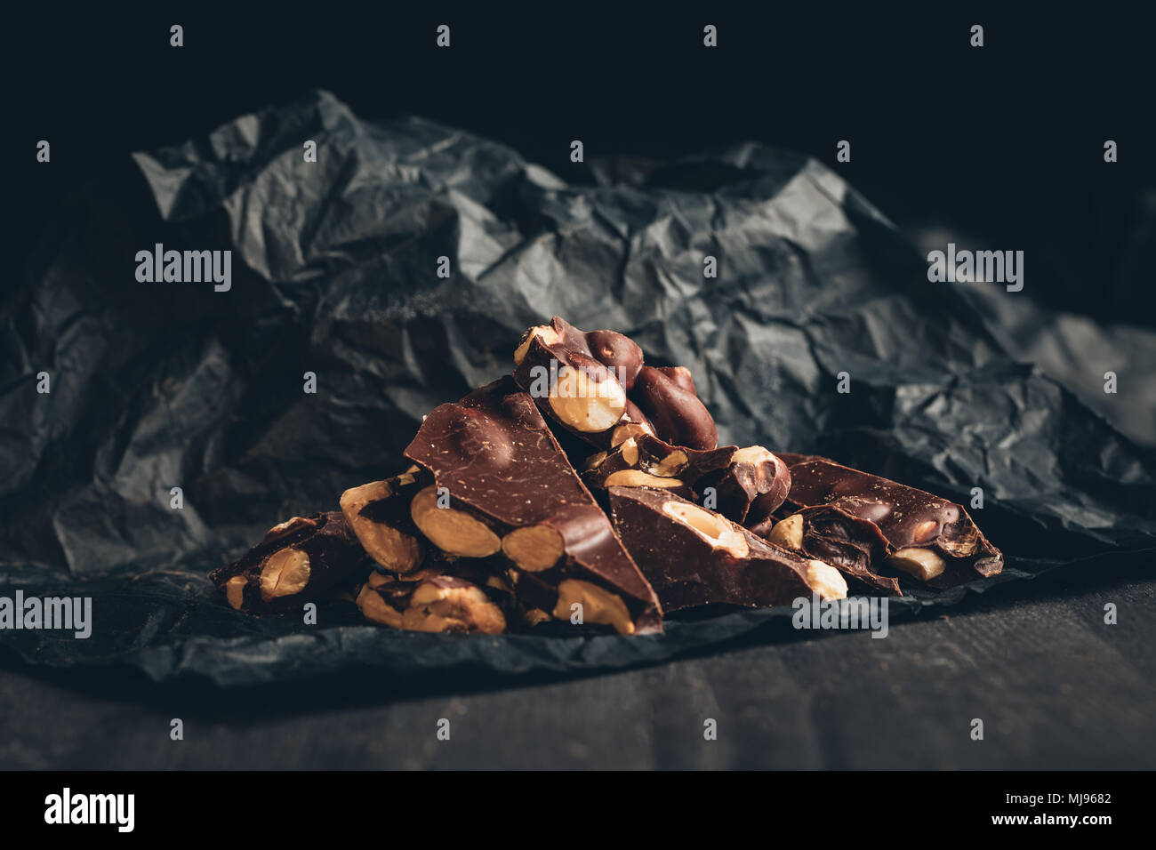 Chocolate on crumpled paper Stock Photo - Alamy