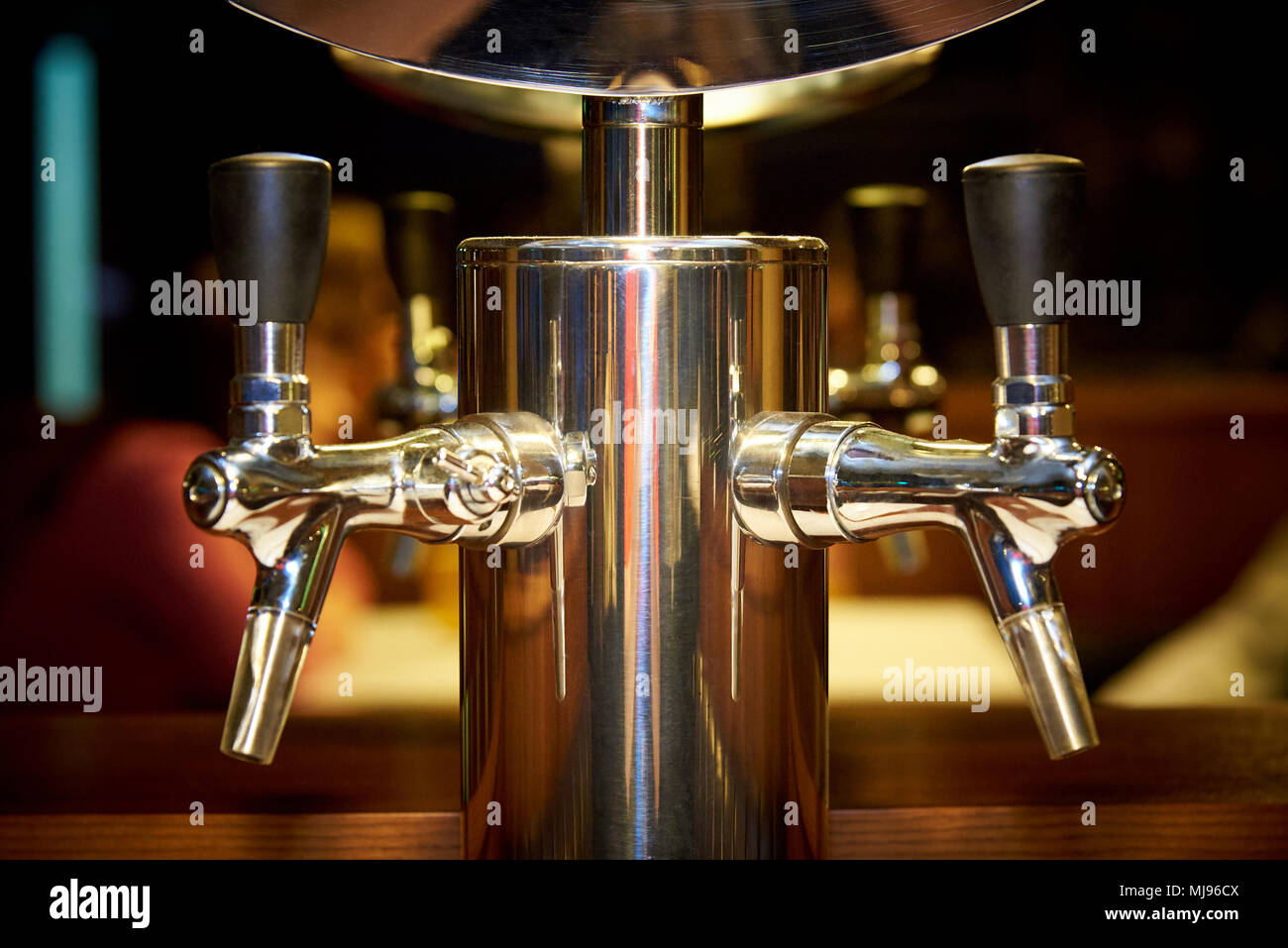 Golden taps for bottling beer on a blurry background close-up Stock ...