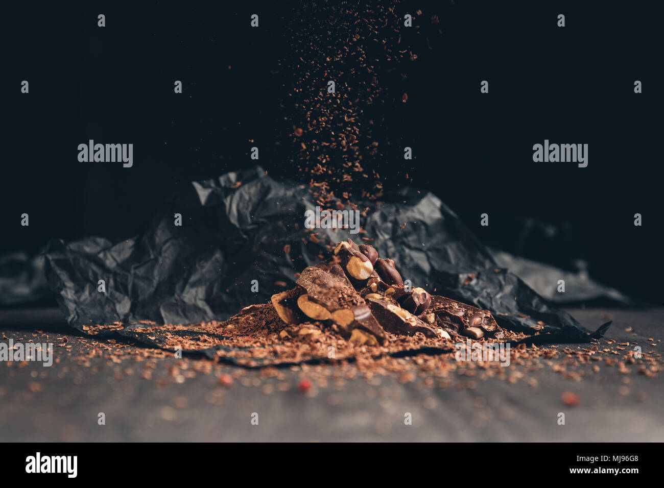 Falling pieces of shredded chocolate Stock Photo - Alamy