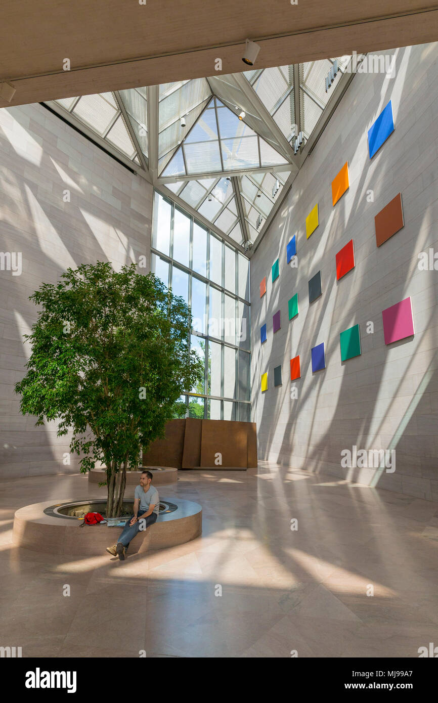 Visitor relaxing, interior, East Wing, National Gallery of Art ...