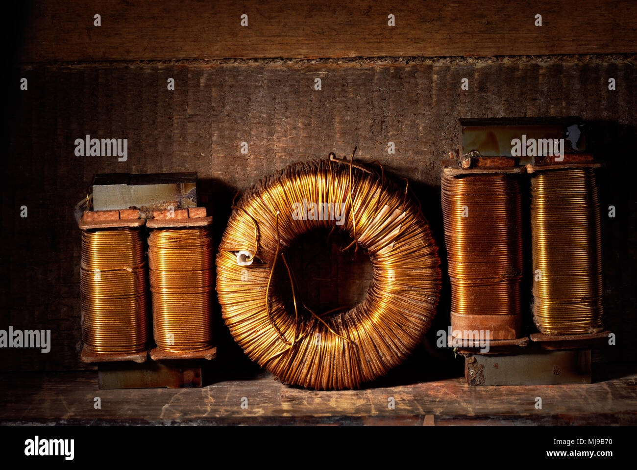 Three old copper wire coils Stock Photo - Alamy