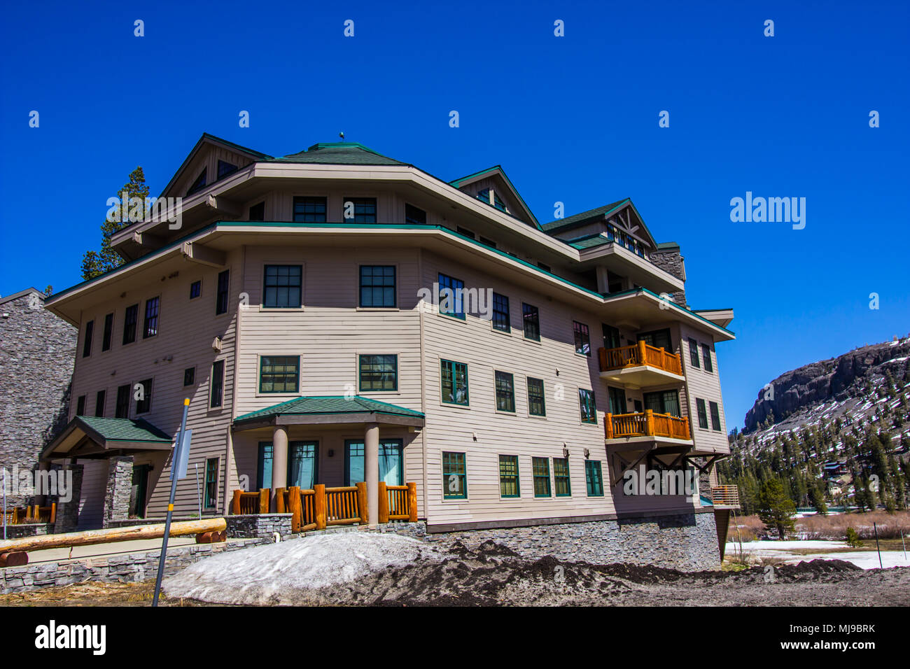 Multi Story Building In Mountains Stock Photo - Alamy