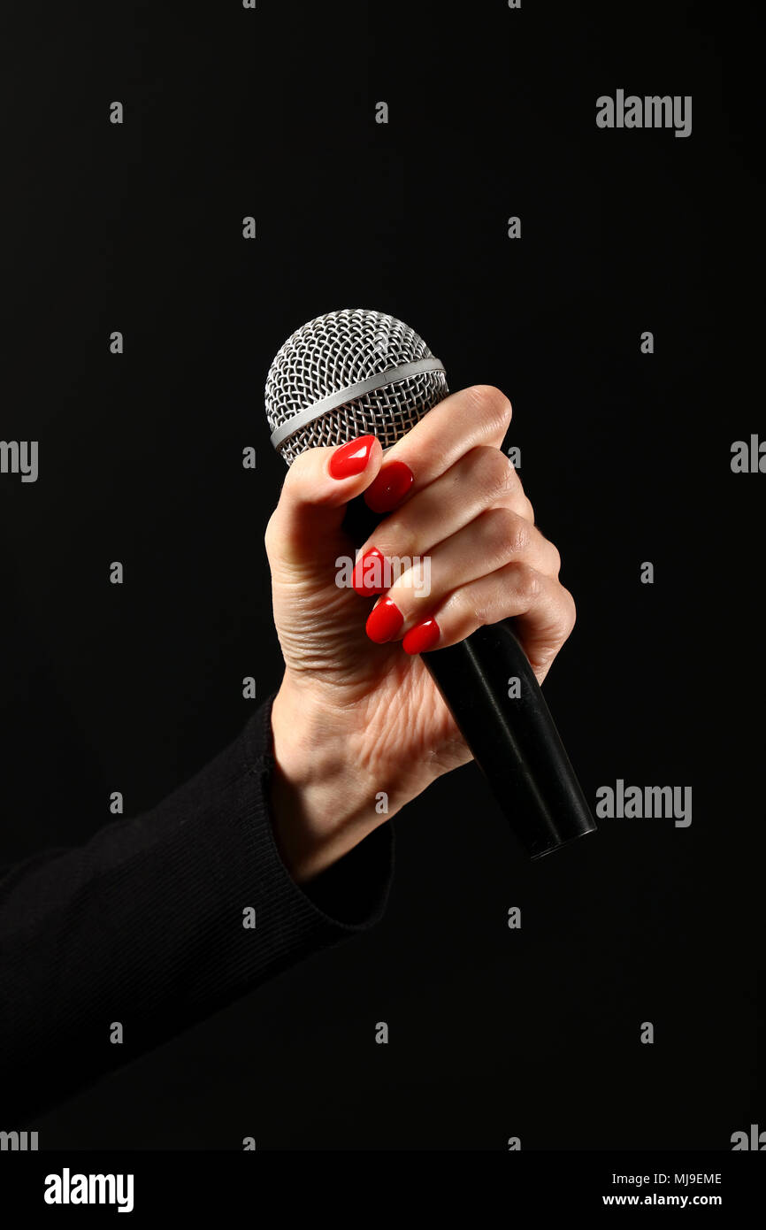 Singer microphone hand hi-res stock photography and images - Alamy
