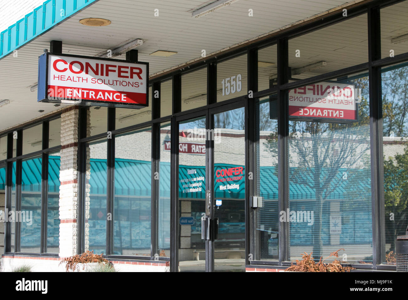 A logo sign outside of a facility occupied by Conifer Health Solutions ...