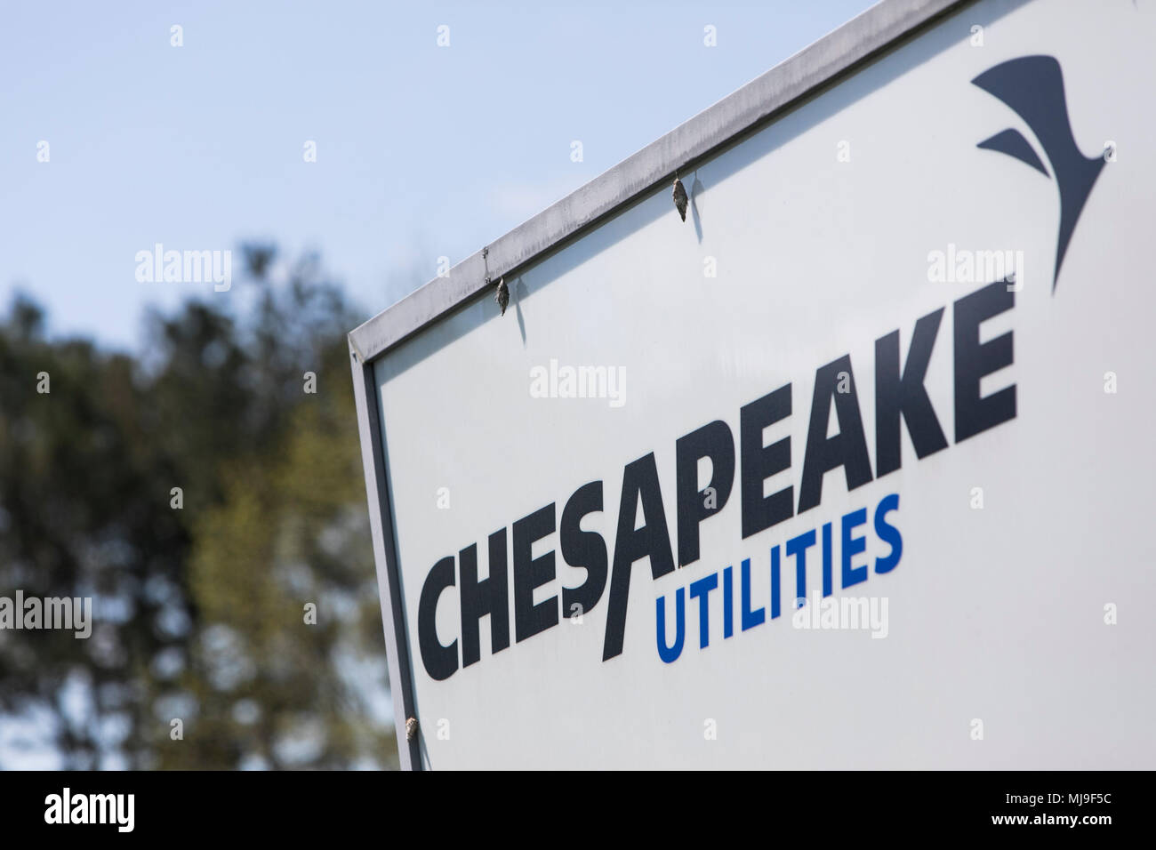 A logo sign outside of a facility occupied by Chesapeake Utilities and ...