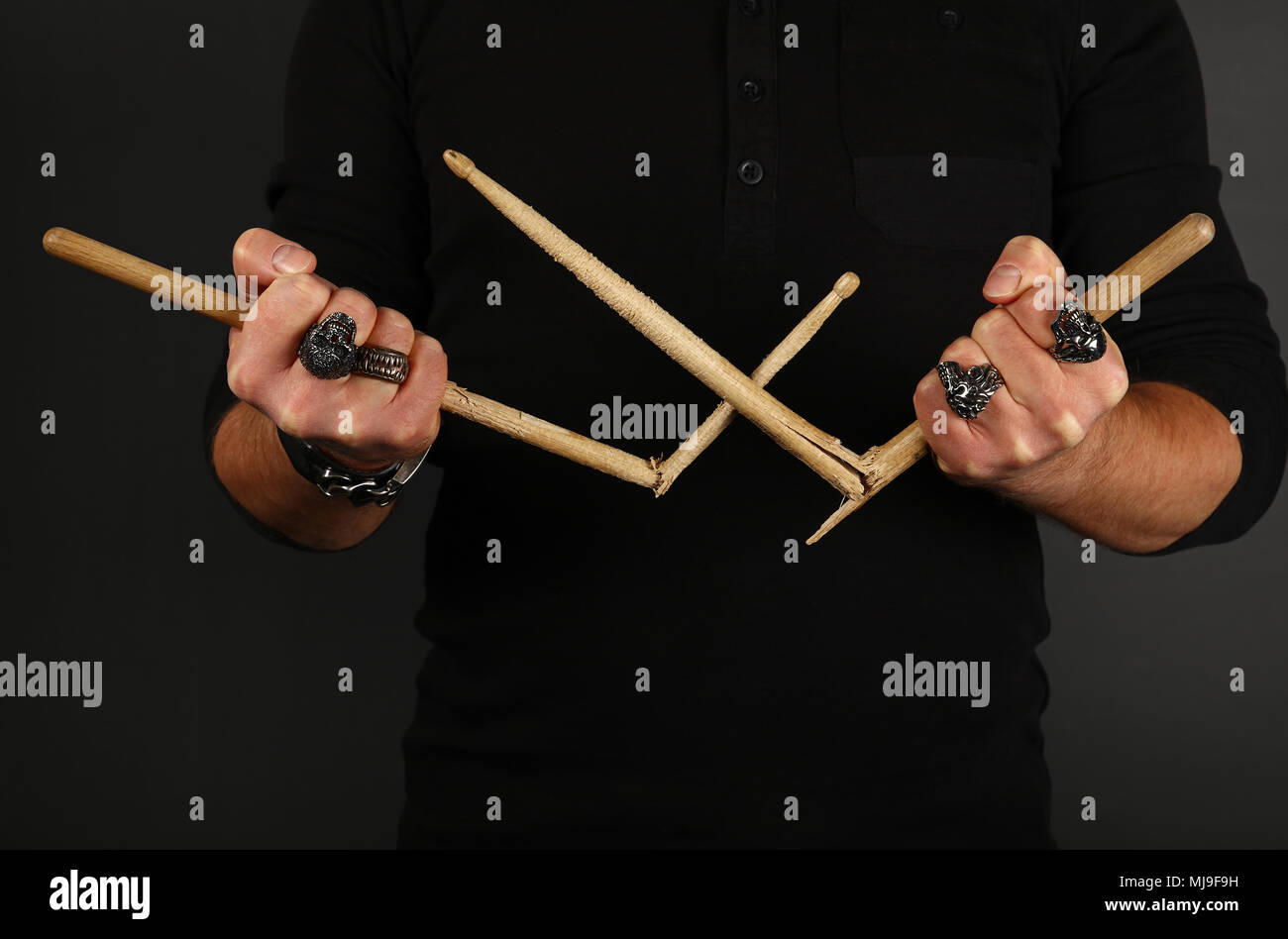 Crossed Black Drumsticks