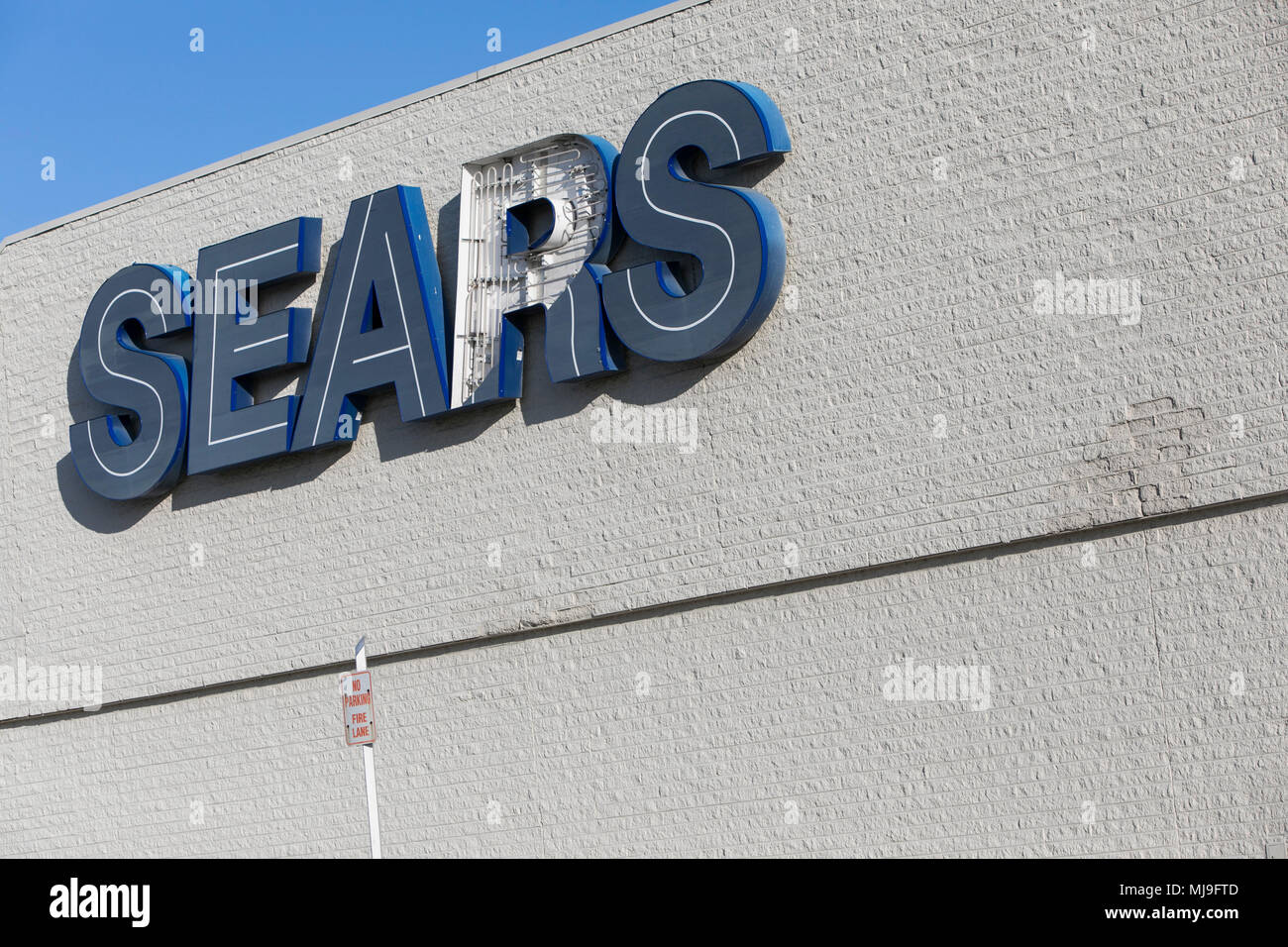 A logo sign outside of a Sears retail store in Annapolis, Maryland on ...