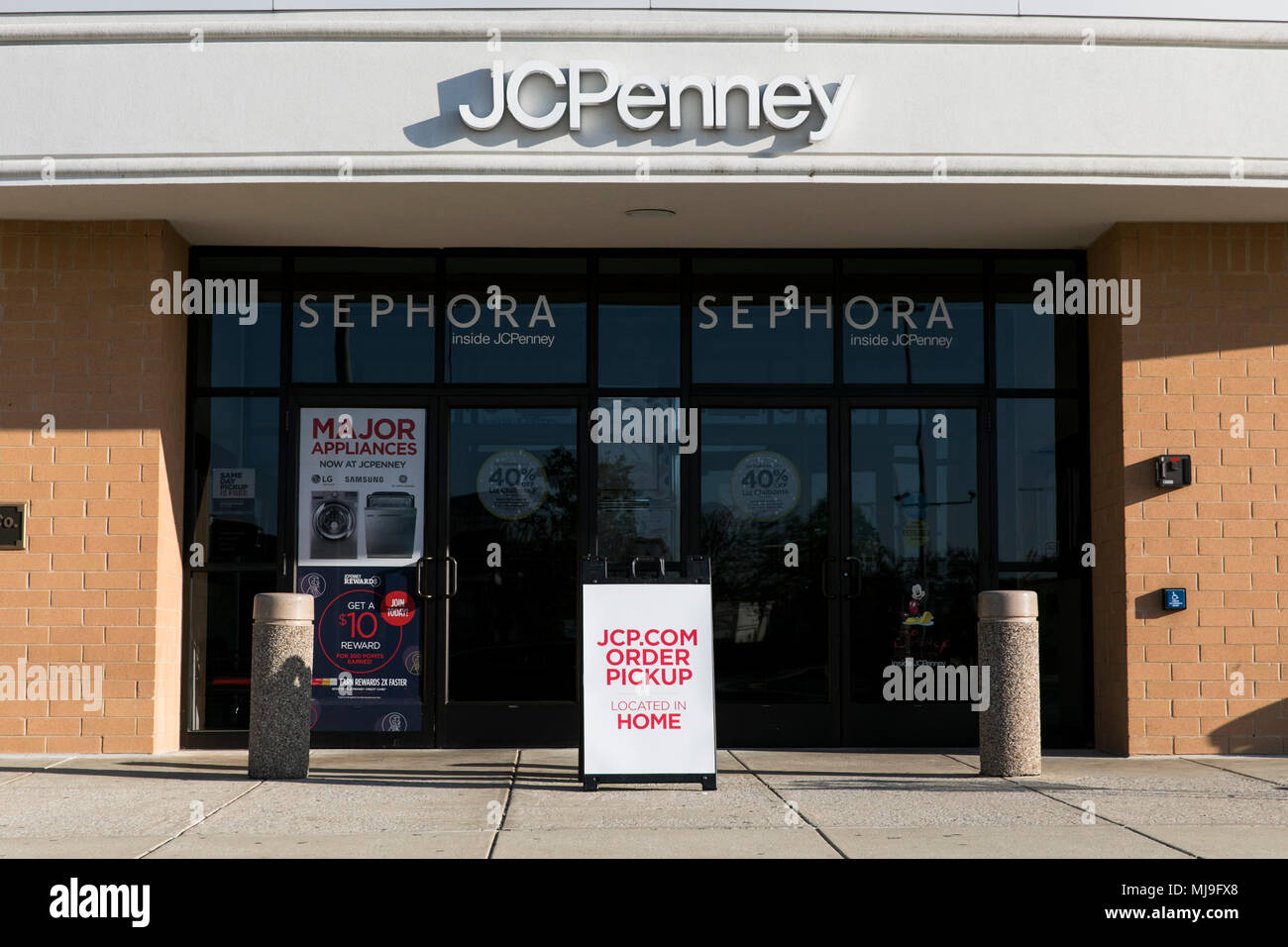 A logo sign outside of a JCPenney retail store in Annapolis, Maryland ...