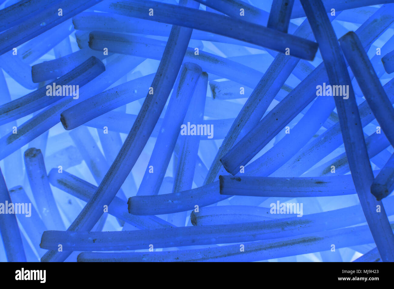 image abstract blue background of curved short sticks Stock Photo - Alamy