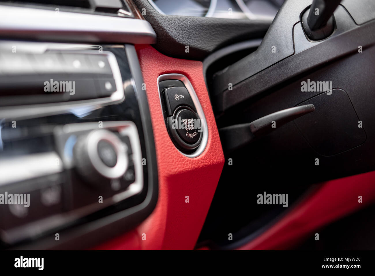 Shallow focus image of an engine Start Stop button seen on the ...