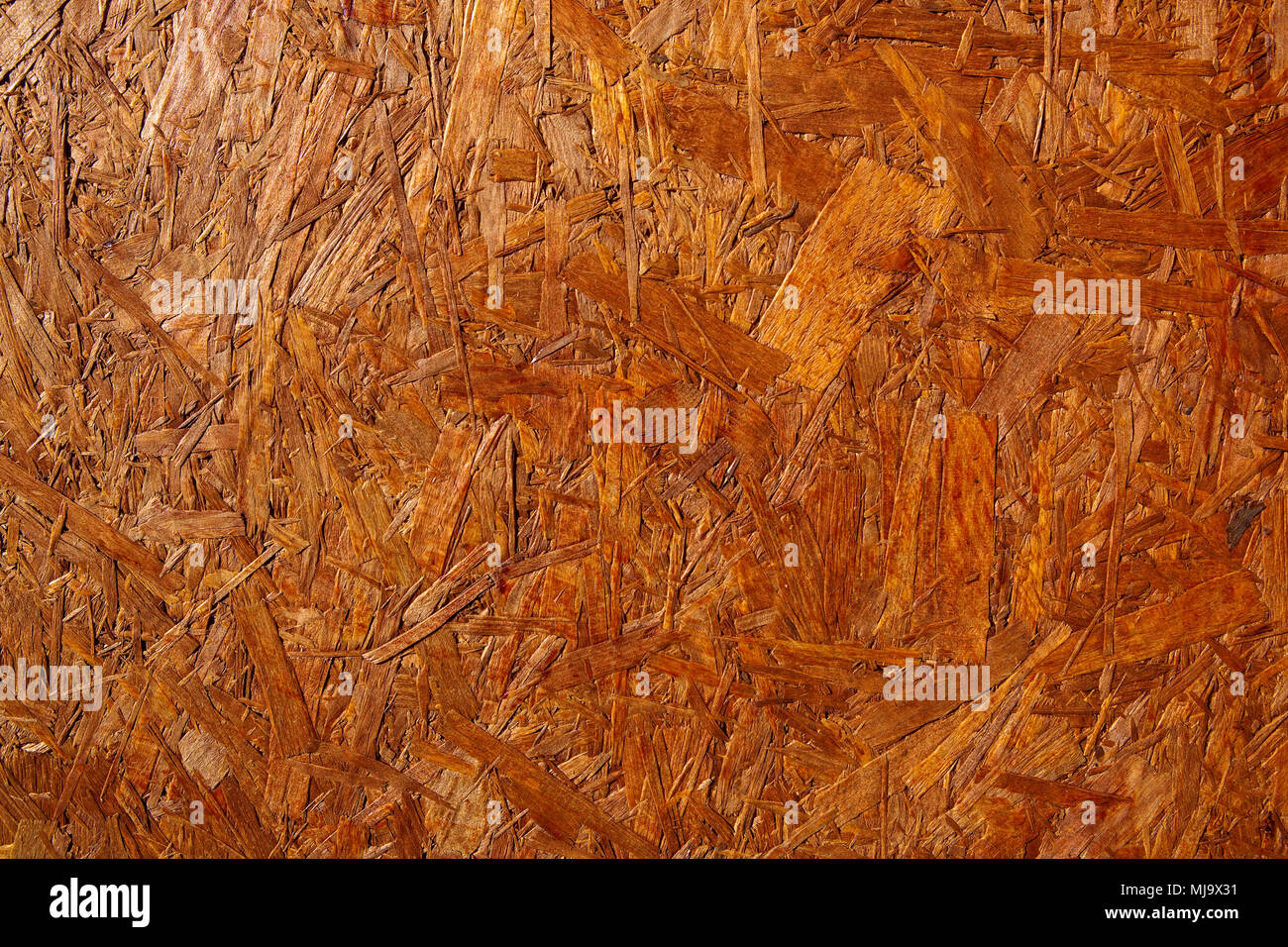 background image of panelling made from wood shards and shavings in an ...