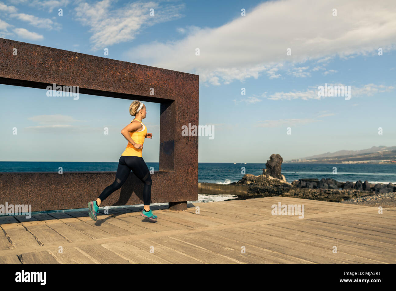 Female running landscape hi-res stock photography and images - Alamy
