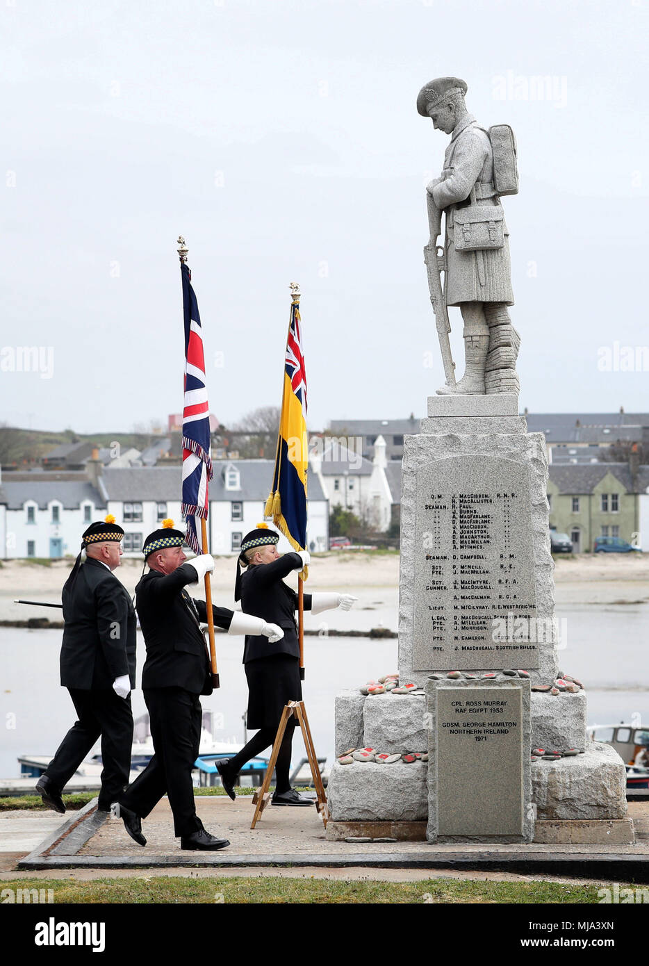 Standard bearers during a commemoration service at the War Memorial in ...