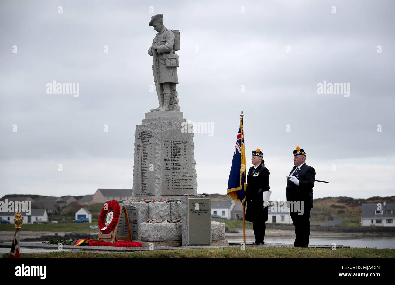 Standard bearers during a commemoration service at the War Memorial in ...