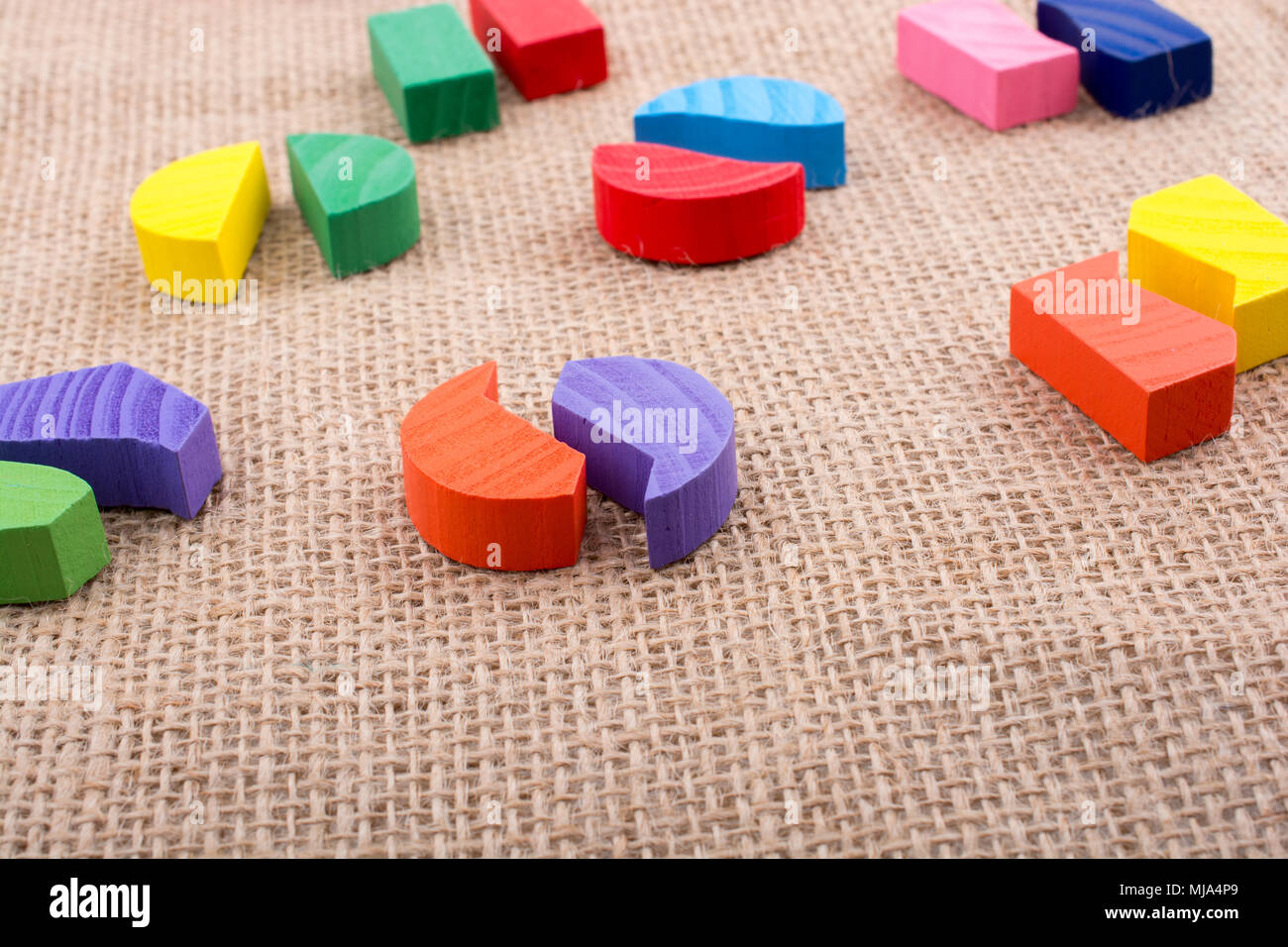 Colorful wooden pieces of a logic puzzle Stock Photo - Alamy