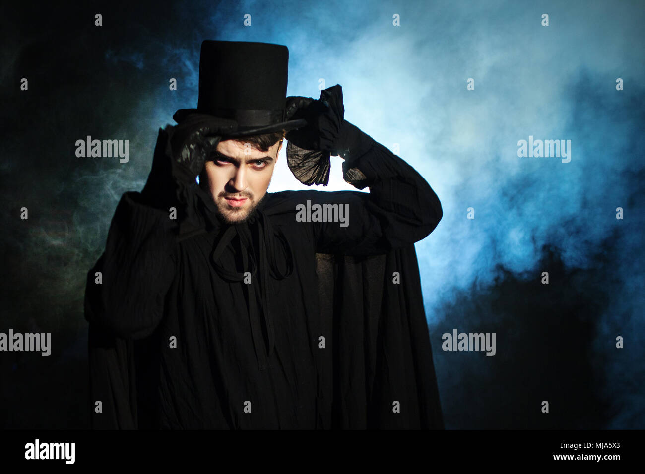 Black hat and cloak hi-res stock photography and images - Alamy
