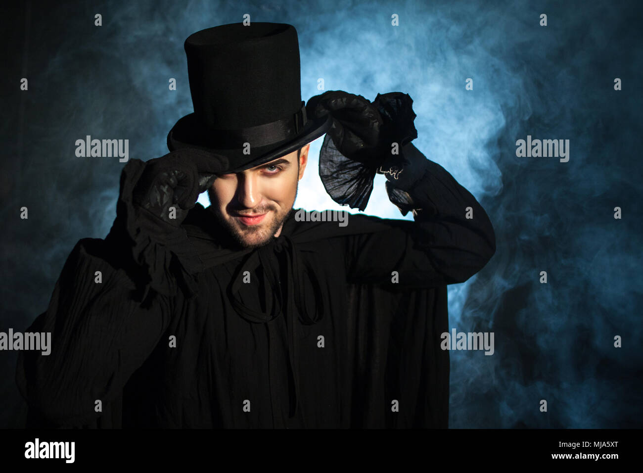 Man in black cloak with hood hi-res stock photography and images - Alamy