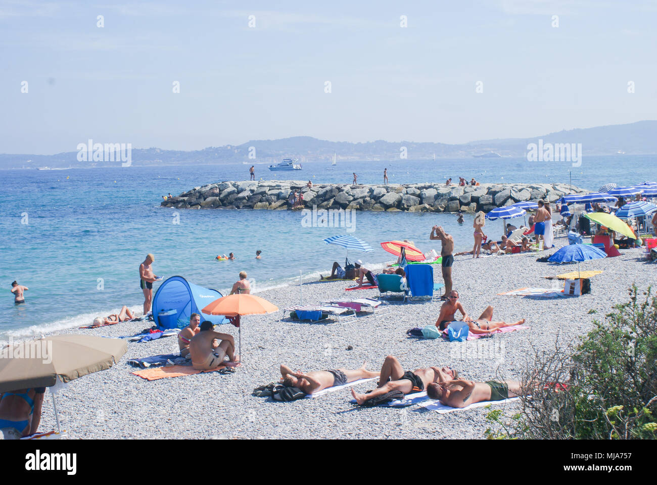 Tourists having a bath at the beach, Saint-Tropez, France Stock Photo ...