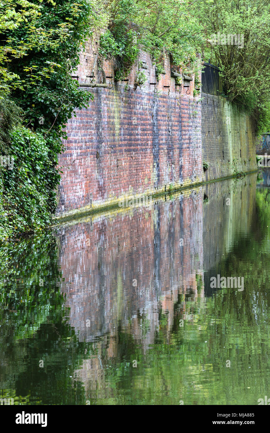 Canal wall reflection Stock Photo - Alamy