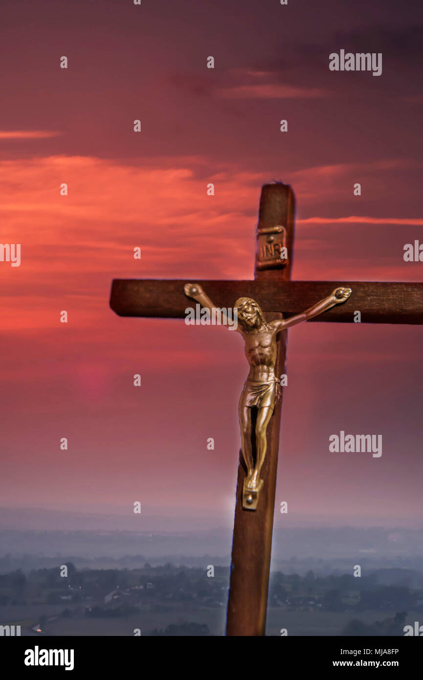 Crucifix on the red sunset - dramatic view Stock Photo - Alamy