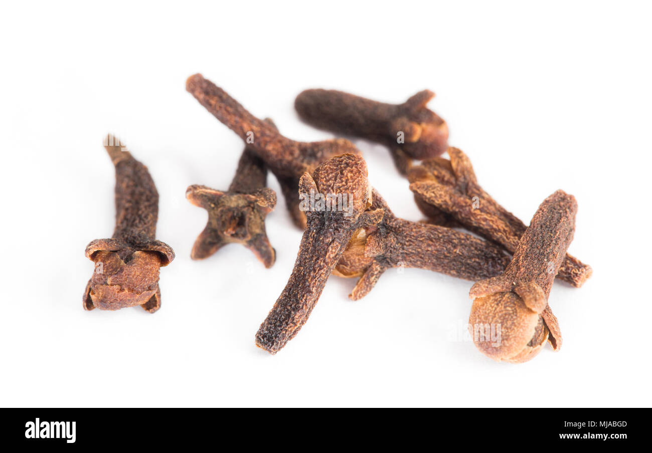 Closeup of cloves on white background Stock Photo - Alamy