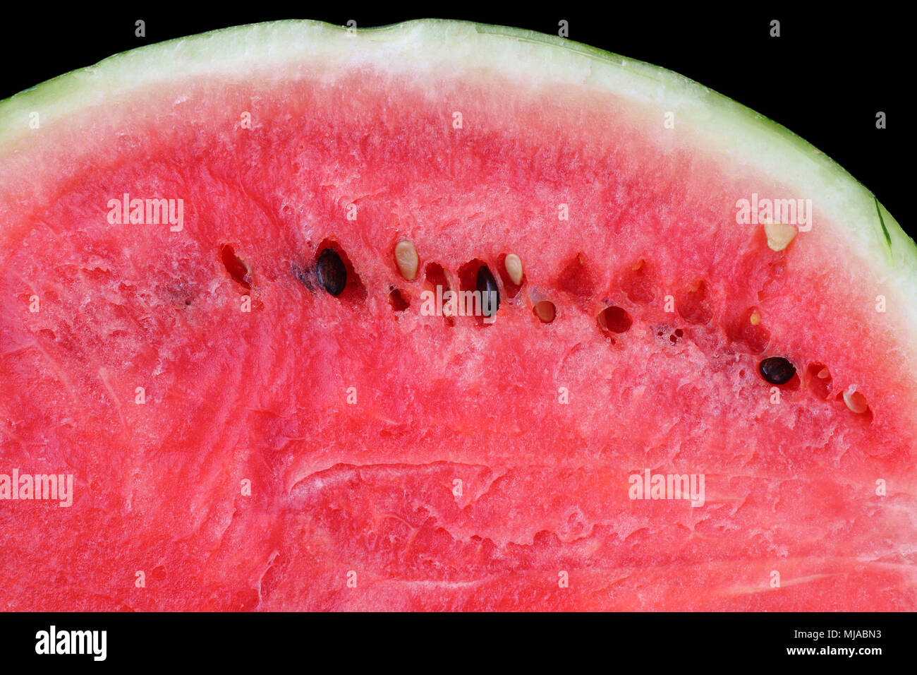 closeup of opened watermelon over black background Stock Photo - Alamy
