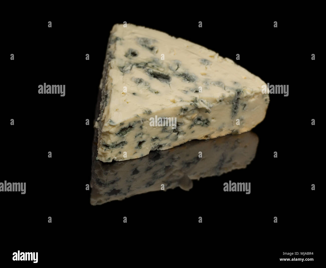 closeup of blue cheese over black background reflection Stock Photo - Alamy