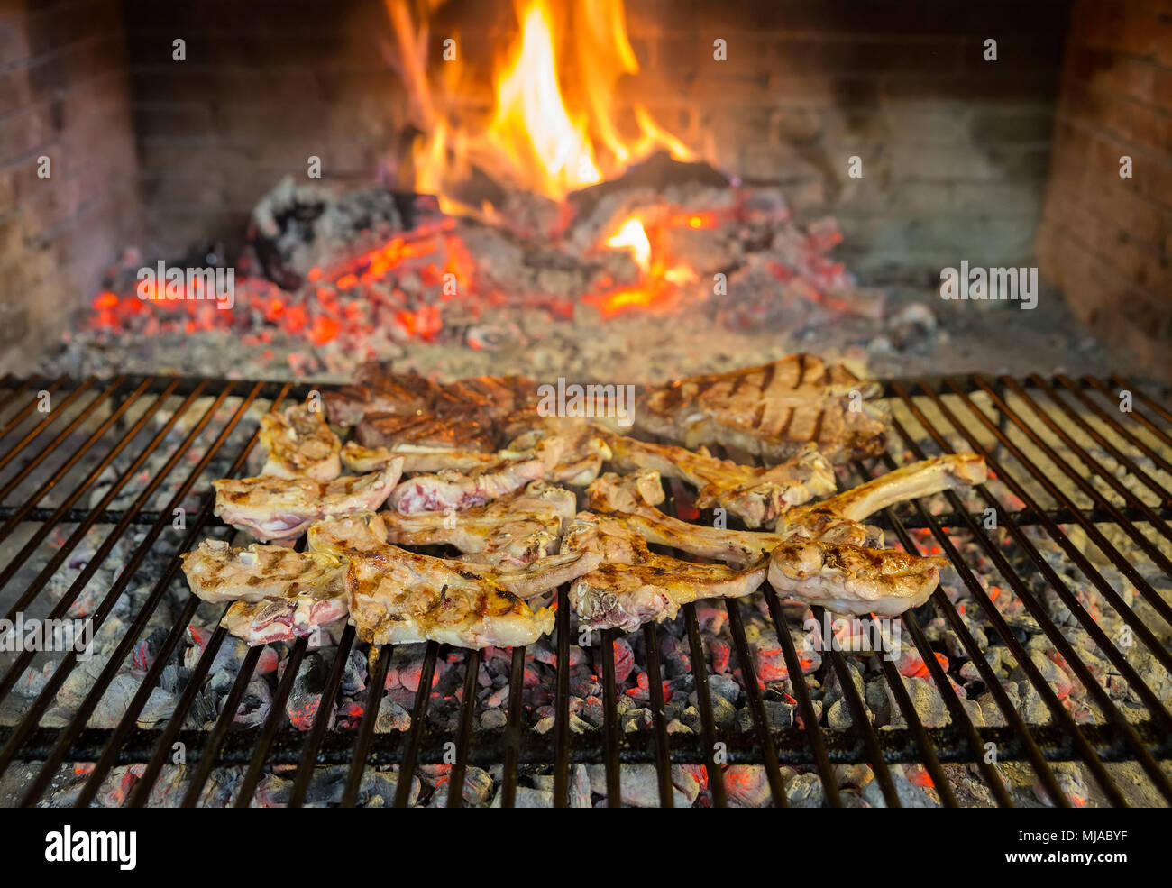 lamb chops on grill and fire, shallow depth of field Stock Photo - Alamy