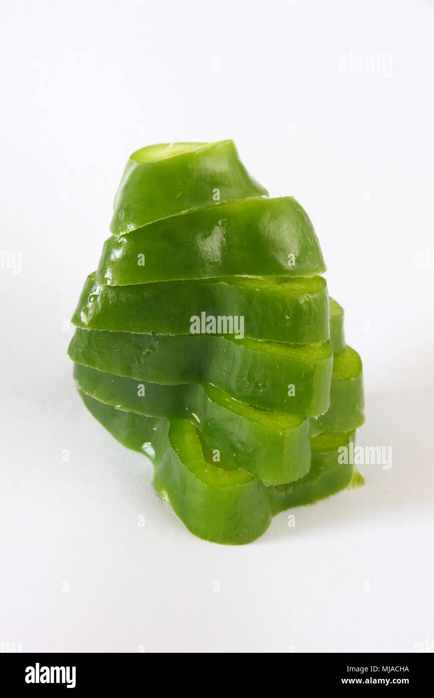 Side view of pile of slices of green pepper Stock Photo - Alamy