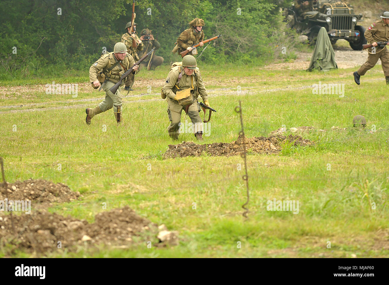 Reenactors put on a show in front of military and civilians during the ...