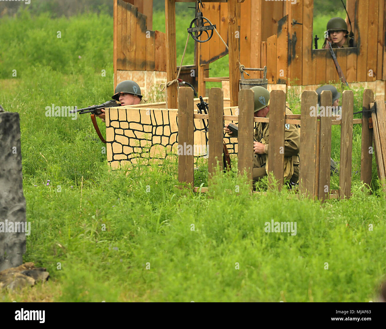 Reenactors put on a show in front of military and civilians during the ...