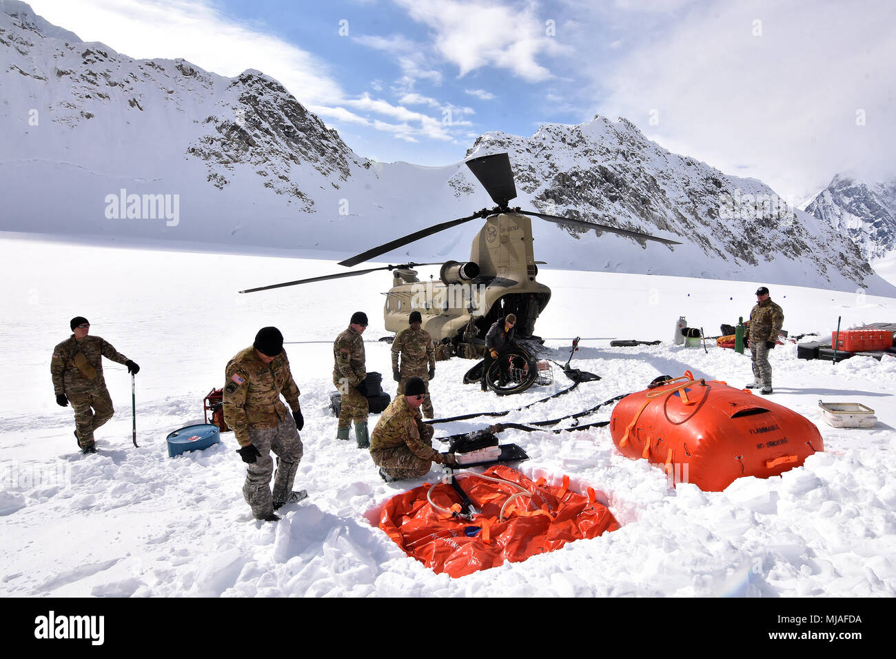 Soldiers and National Park Service personnel pump fuel into fuel ...