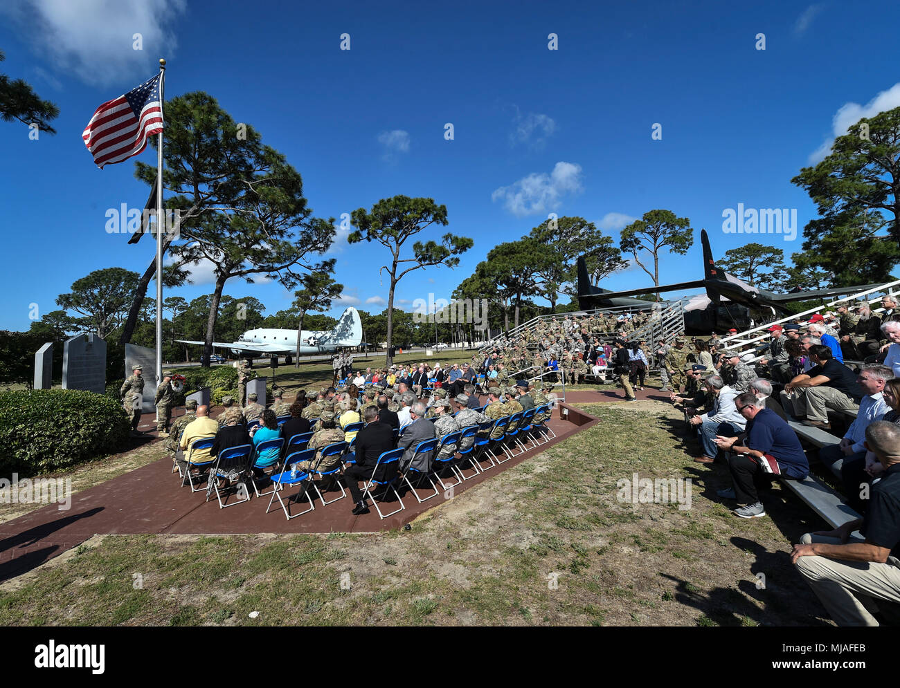 Airmen and families listen as U.S. Air Force Col. (Ret.) George Ferkes ...
