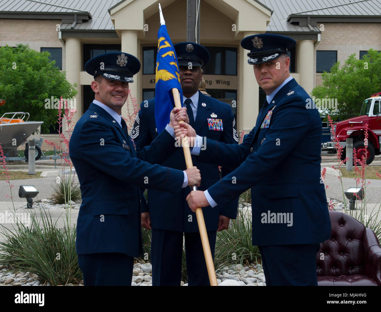 Col. Ted Glasco, 47th Mission Support Group commander, accepts the ...