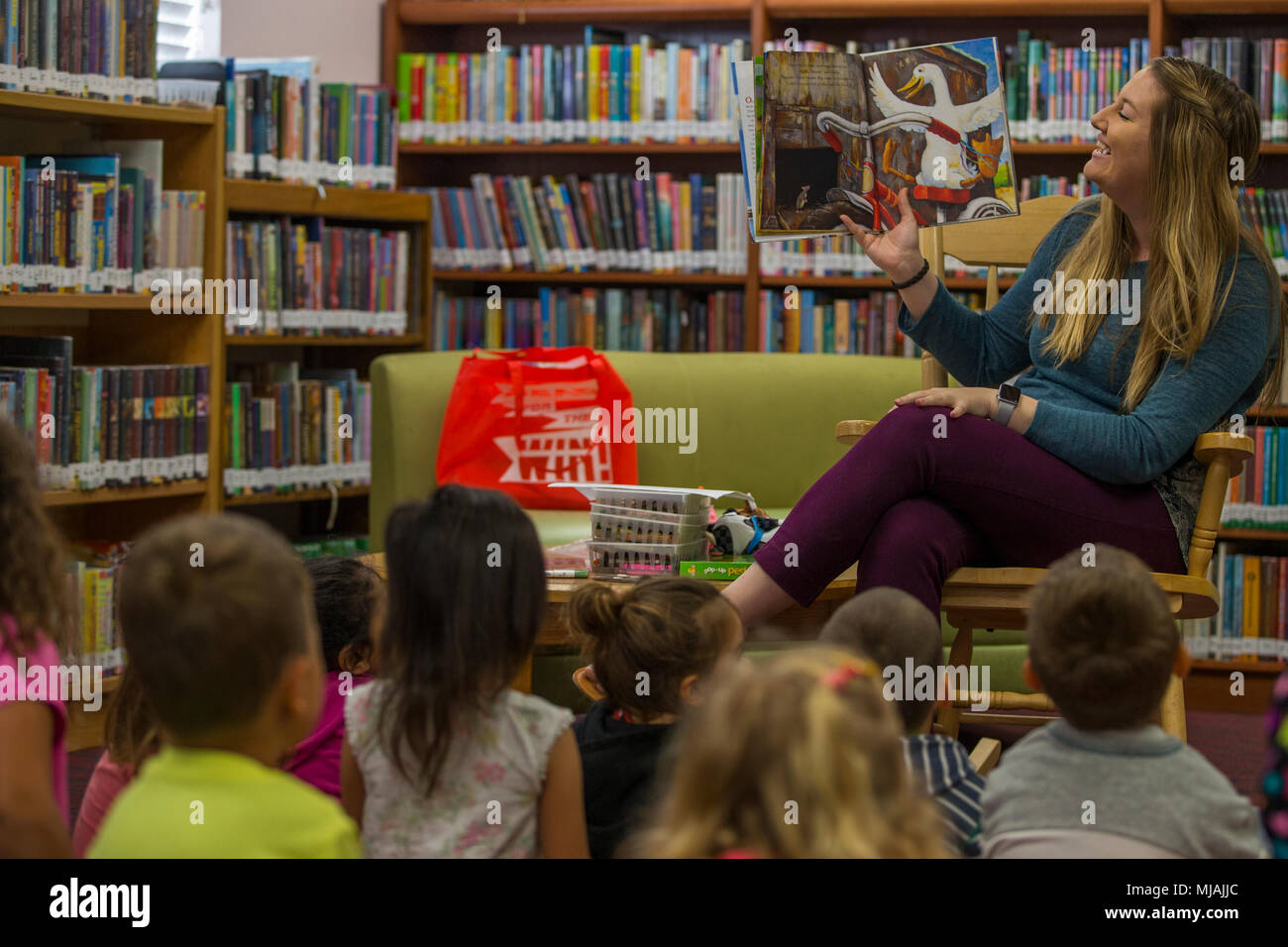 Jamie Collins, a youth services librarian, hosts preschool story time ...