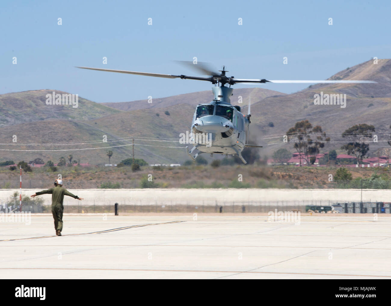 A Marine with Marine Light Attack Helicopter Squadron (HMLA) 469 ...