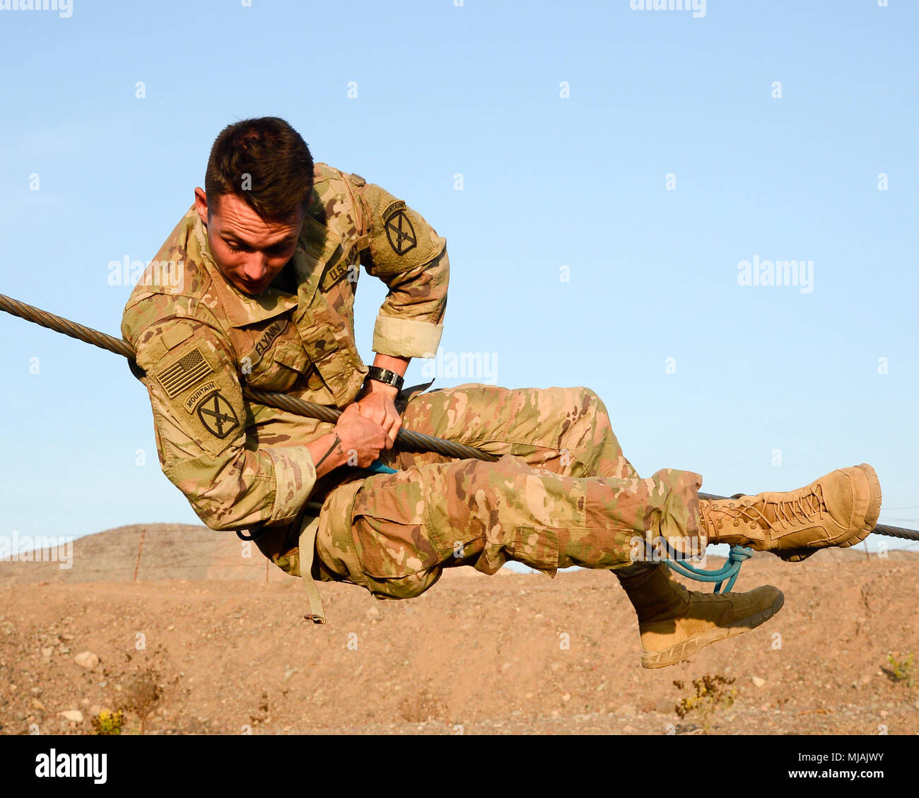 U.S. Army Spc. Travis Flynn, assigned to Alpha Company, 1st Battalion ...