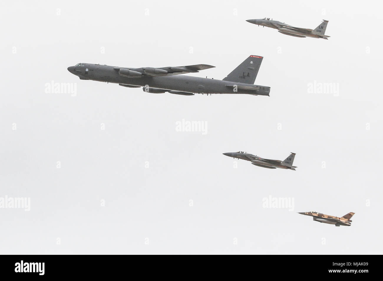 A U.S. B-52 Stratofortress bomber and two F-18 Hornets are accompanied ...