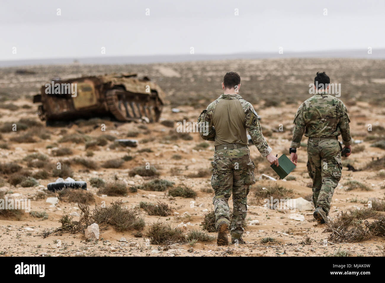 Air Force TSgt. Daniel Marcantonio and SrA. Christian Miller approach a ...