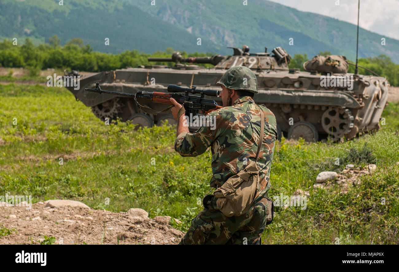 A Bulgarian sniper assigned to 1st Battalion, 61st Mechanized Brigade ...