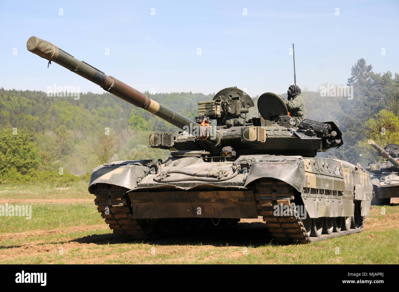 A Ukrainian Army soldiers maneuver a T-84 tank into position in the ...