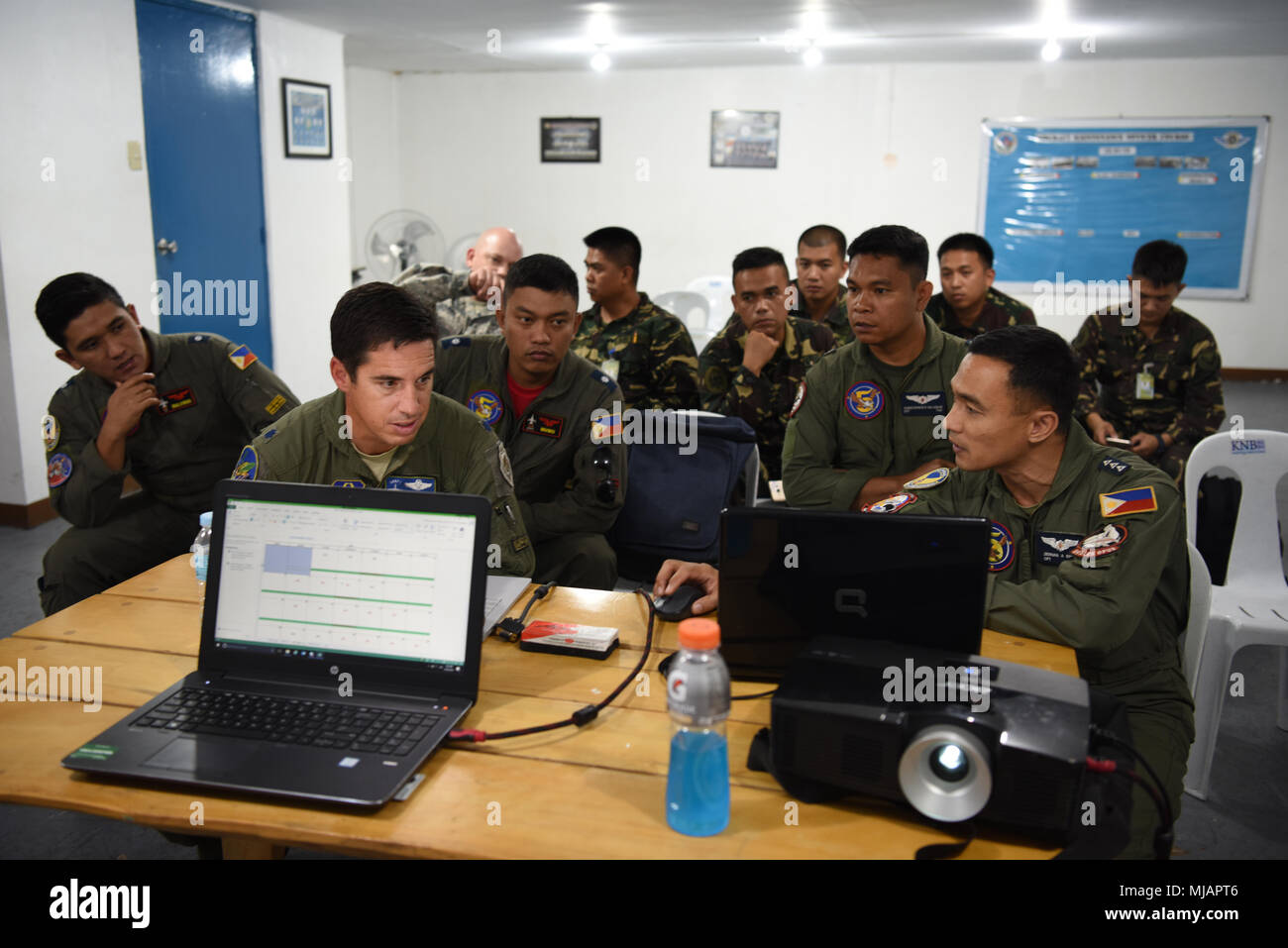 Members of the U.S. and Philippine Air Forces discuss aircraft ...