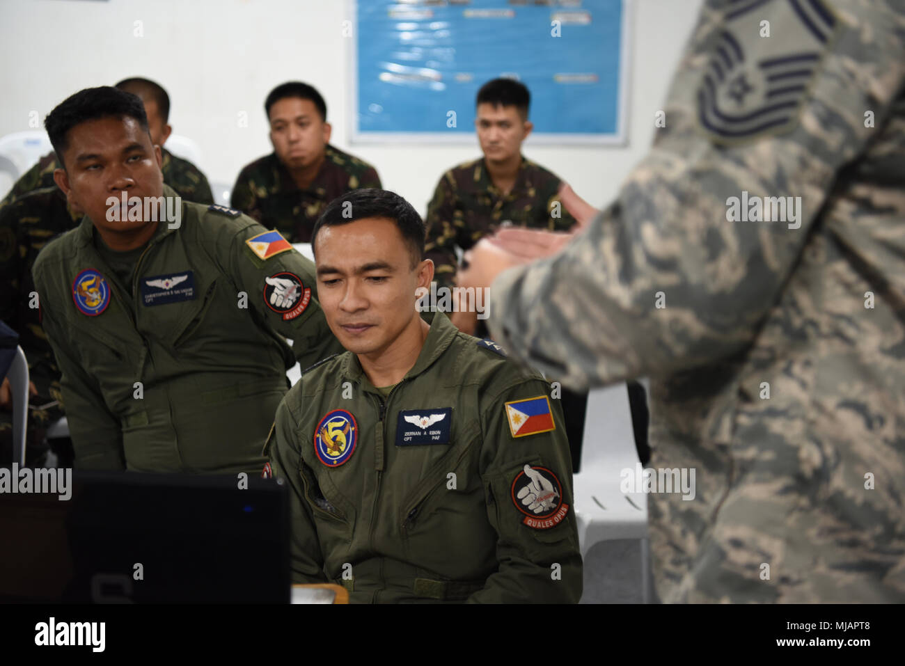 Members of the U.S. and Philippine Air Forces discuss aircraft ...