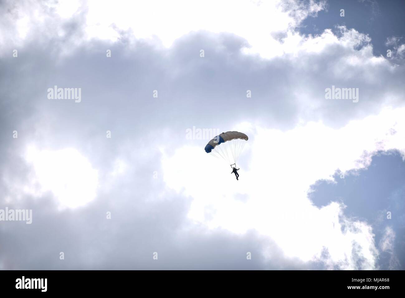 A U.S. Air Force Academy Parachute Team Wings of Blue member performs a ...
